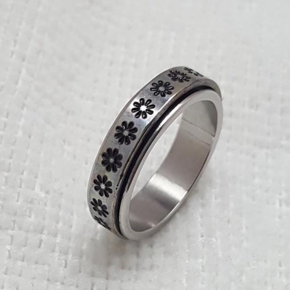 Ring | Jewelry | Silver And Black Stainless Steel Spinner Flower Ring ...
